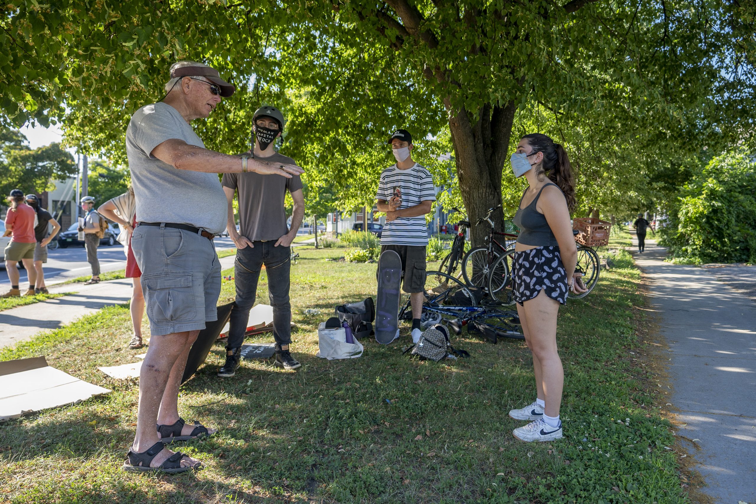 Police defenders and protesters exchange harsh words outside Burlington ...