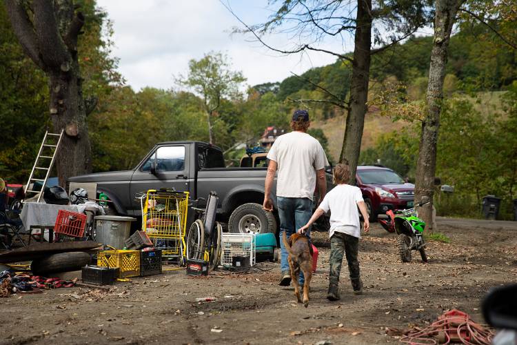 After a man and his son witness a horrific murder, their settlement is ...