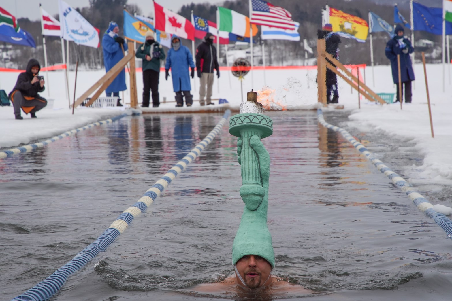 PHOTOS: Swimmers brave single-digit temperatures for annual festival at ...